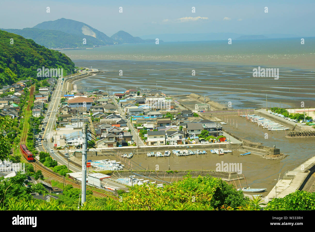 Misumi Line Train running mudflat of Ariake Sea in background, Kumamoto ...