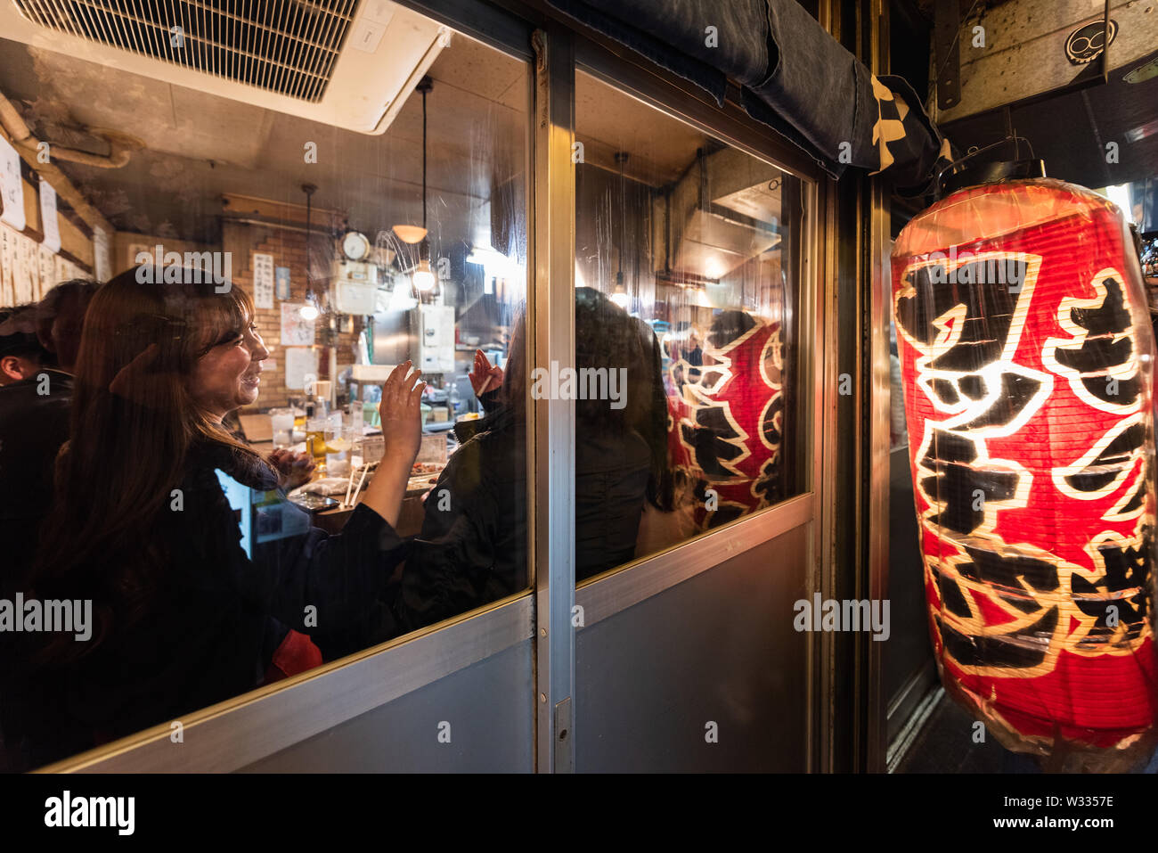 Shinjuku, Japan - April 4, 2019: Japanese women sitting in local ...