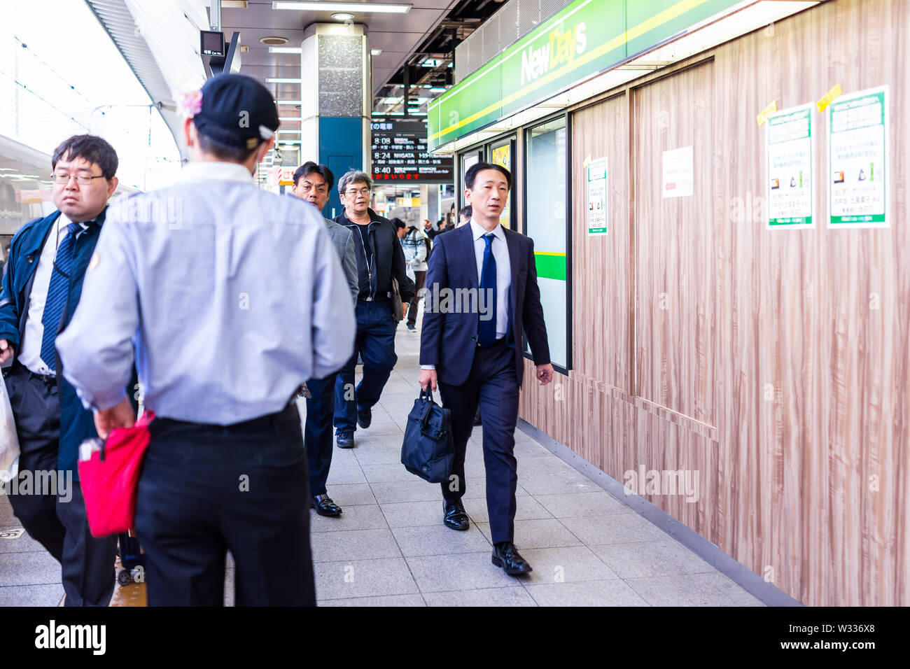Tokyo, Japan - April 4, 2019: Japanese conductor on platform of ...