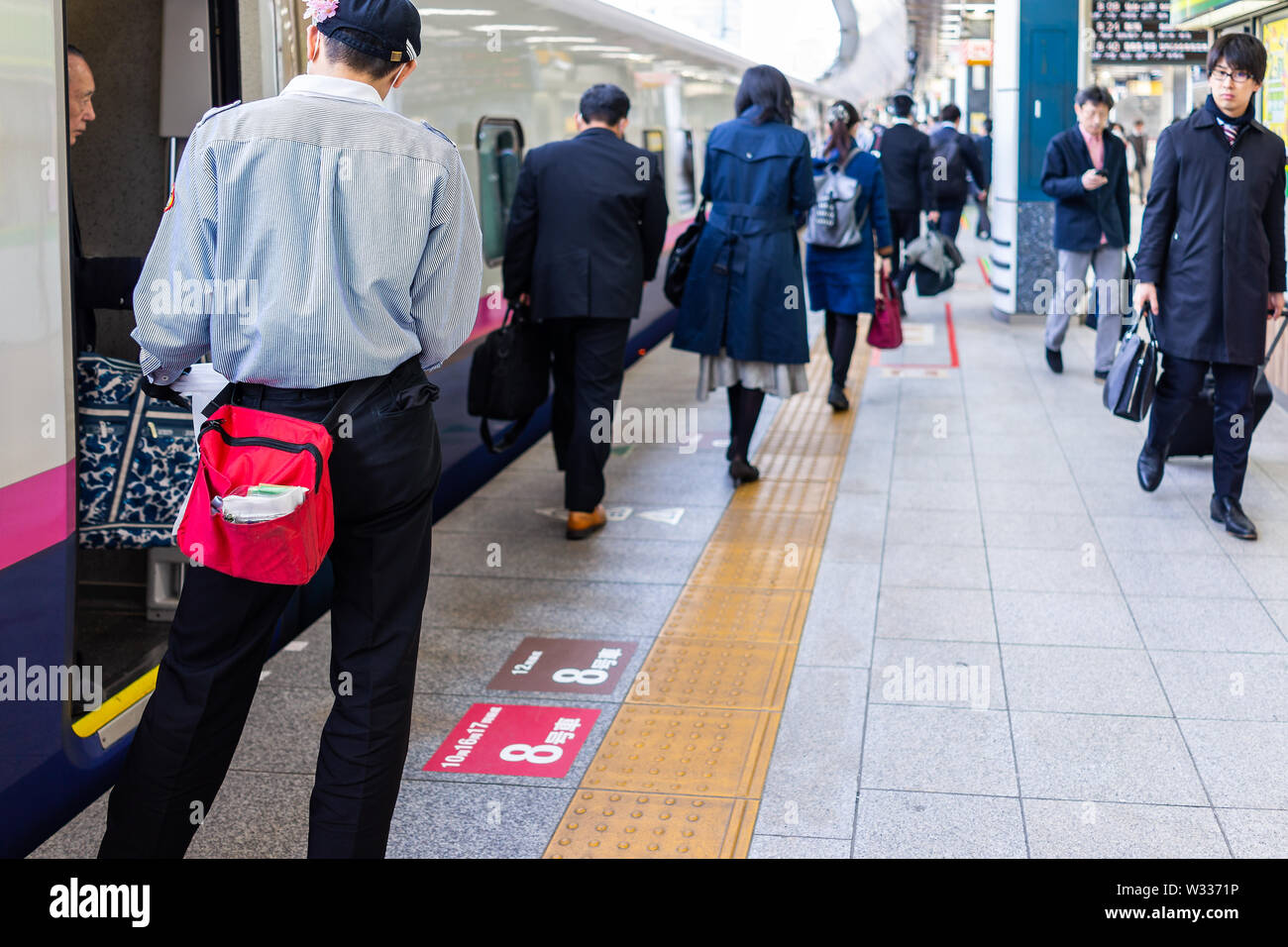 Tokyo, Japan - April 4, 2019: Japanese conductor on platform of ...