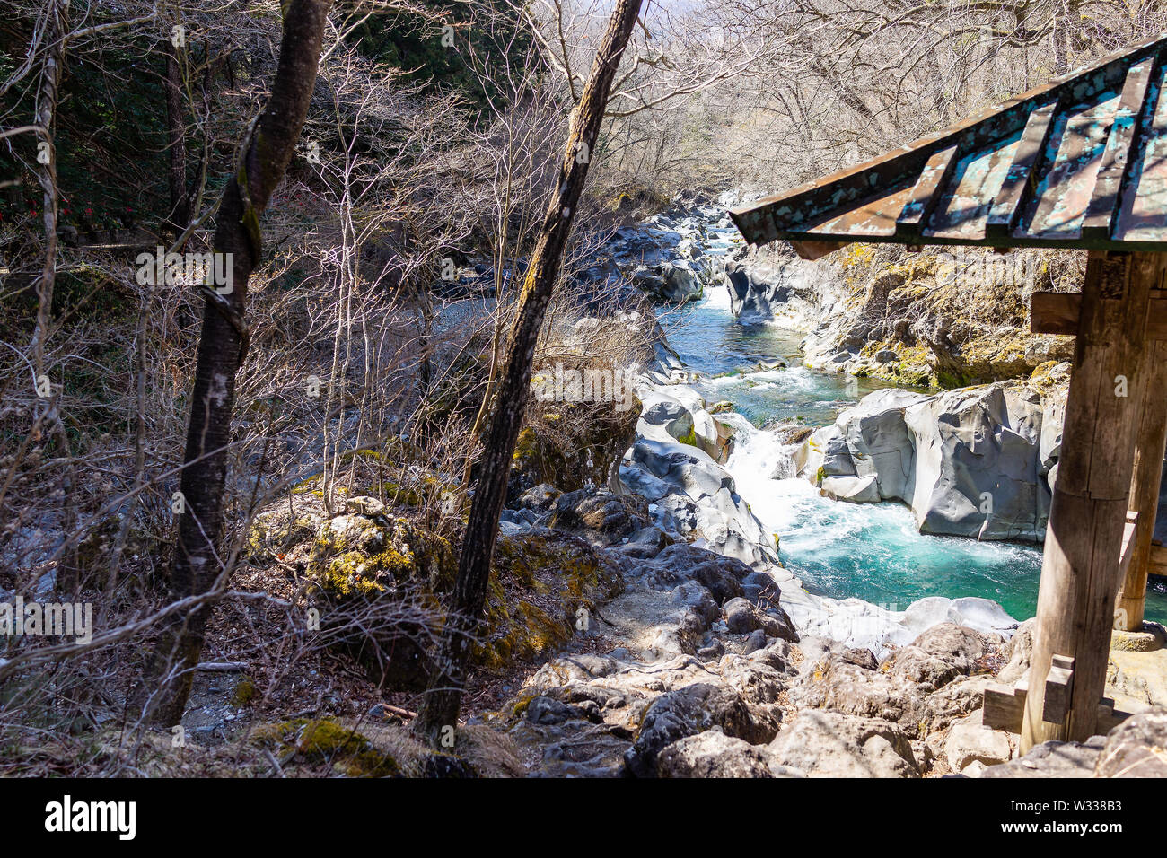 Daiya river flowing water with rocky shore, rocks and gazebo at ...