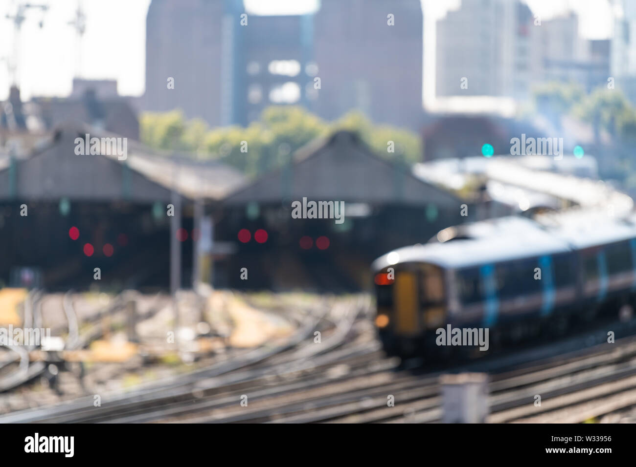 Defocused blurred view on industrial railroad transport tracks in ...