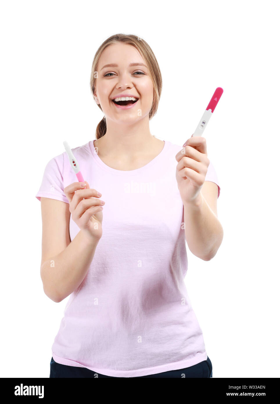Happy young woman with pregnancy test on white background Stock Photo ...