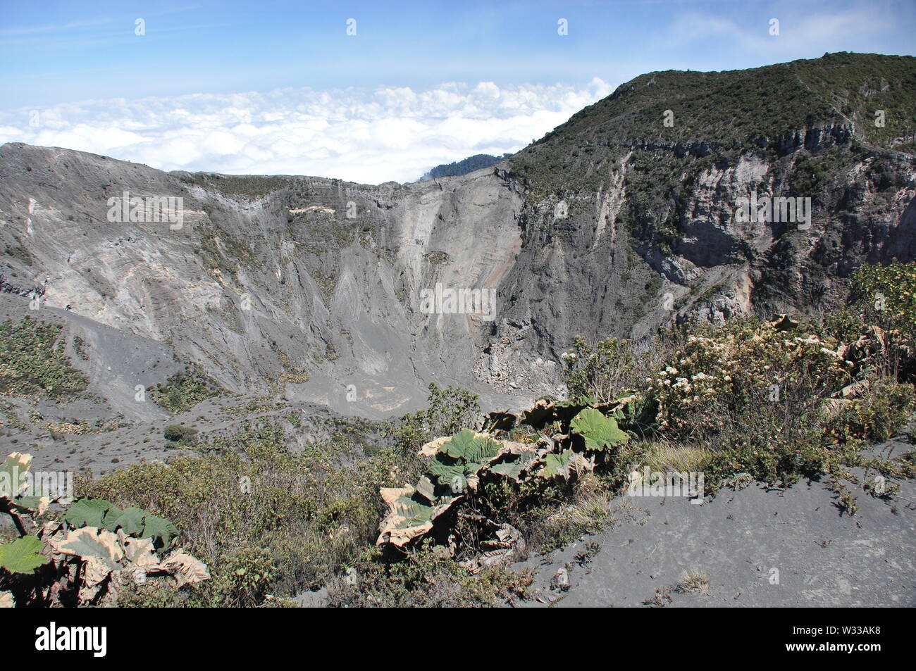 Irazu volcano in Costa Rica. Crater in clouds with protective barriers ...