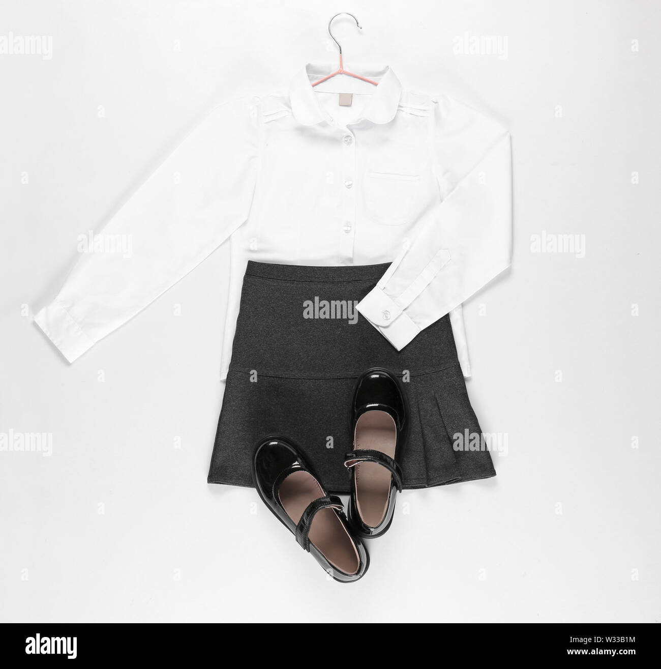 Stylish school uniform on white background Stock Photo - Alamy