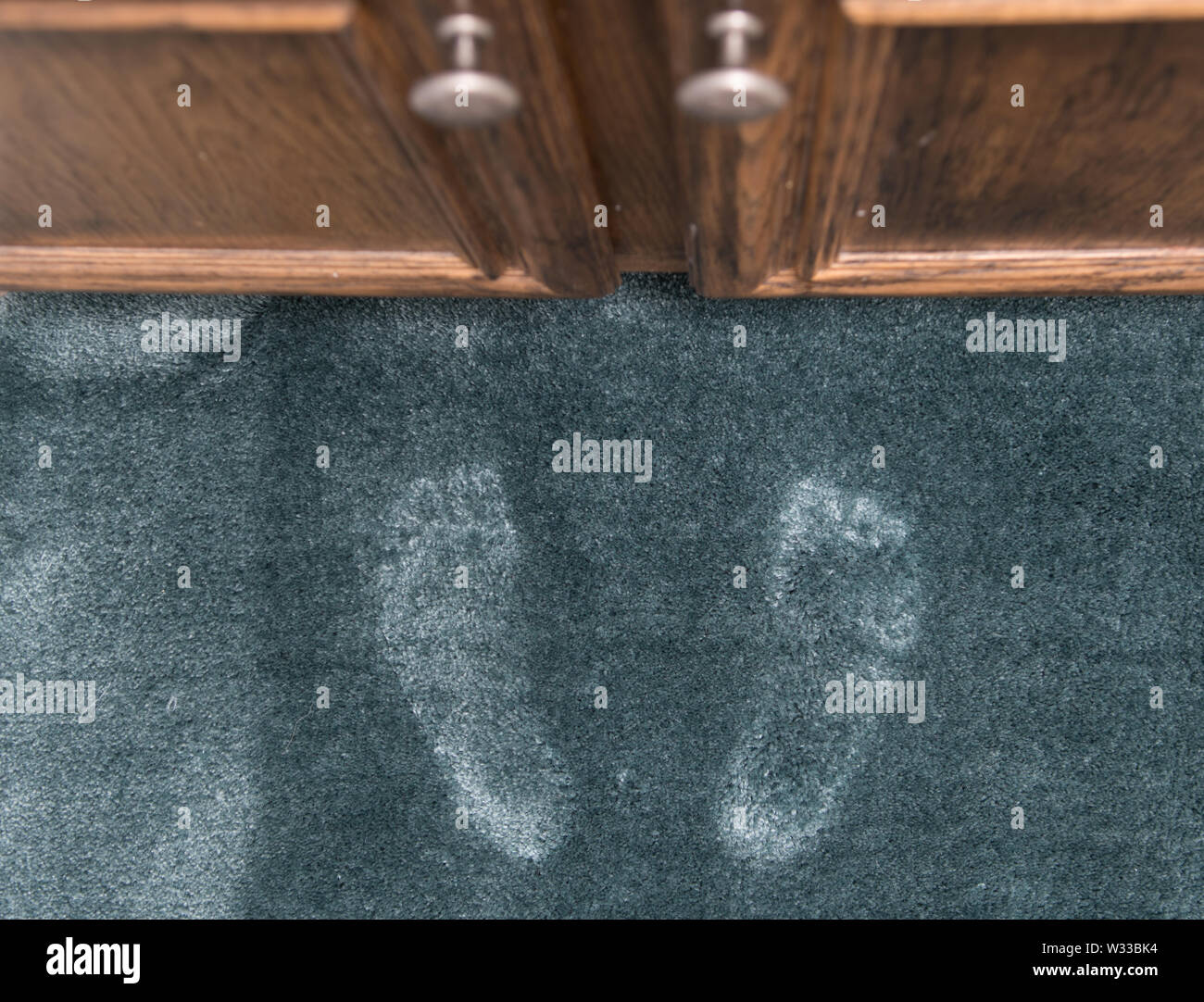 green bath mat with footprints. Bathroom scene Stock Photo - Alamy