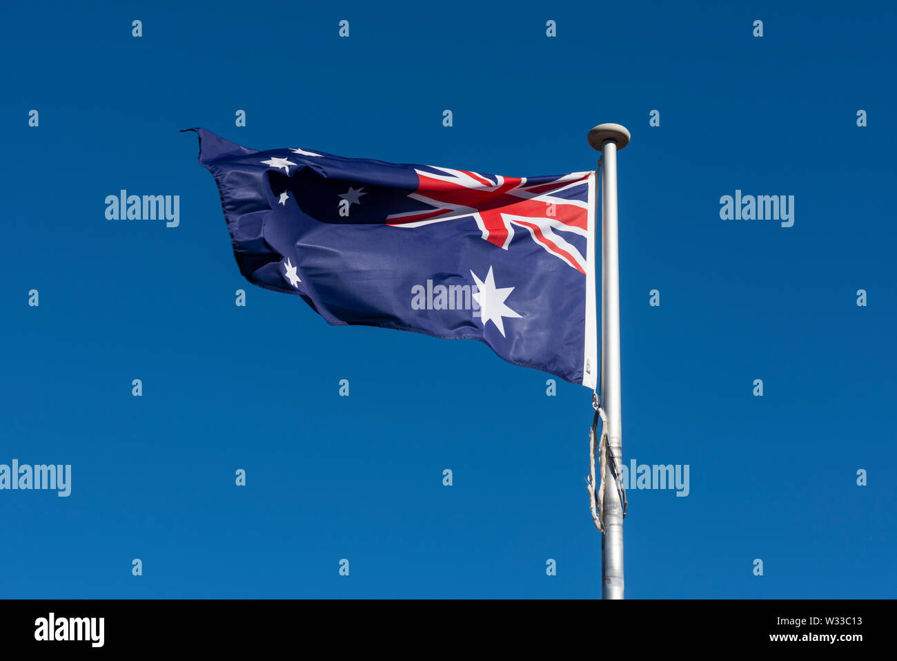 Australian flag flying in wind hi-res stock photography and images - Alamy