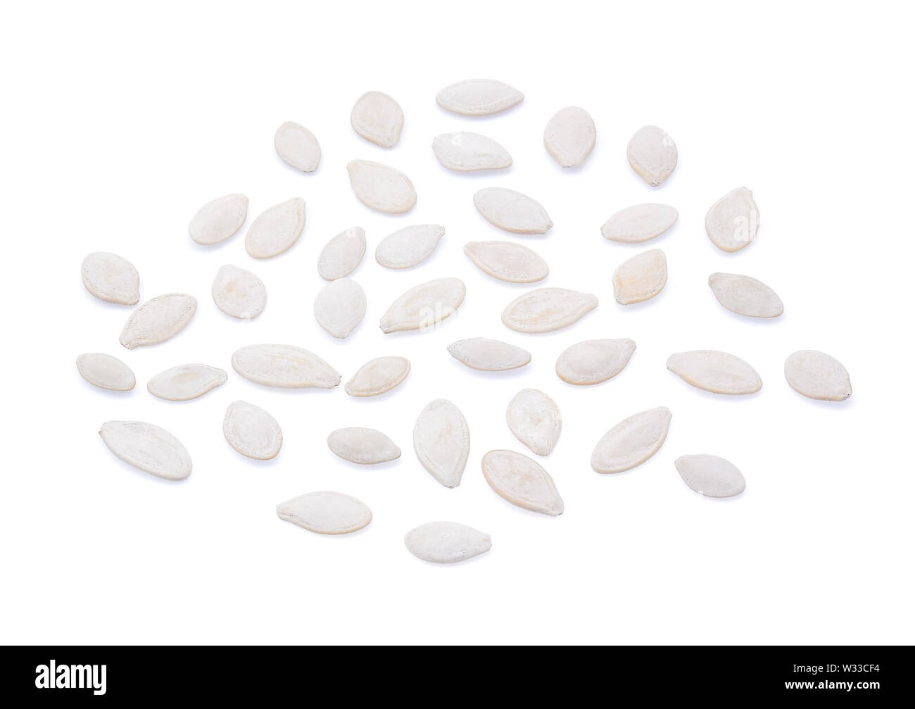 Pumpkin seeds on white background Stock Photo - Alamy