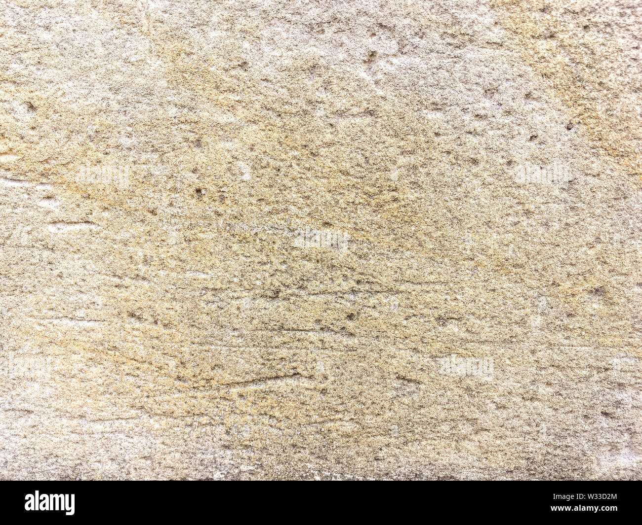 Old beige cracked limestone wall, close up. Texture of brown ancient ...