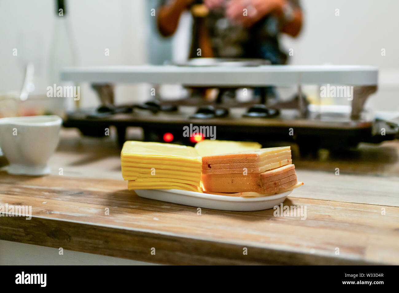Swiss or Dutch raclette table filled with ingredients for a celebratory ...