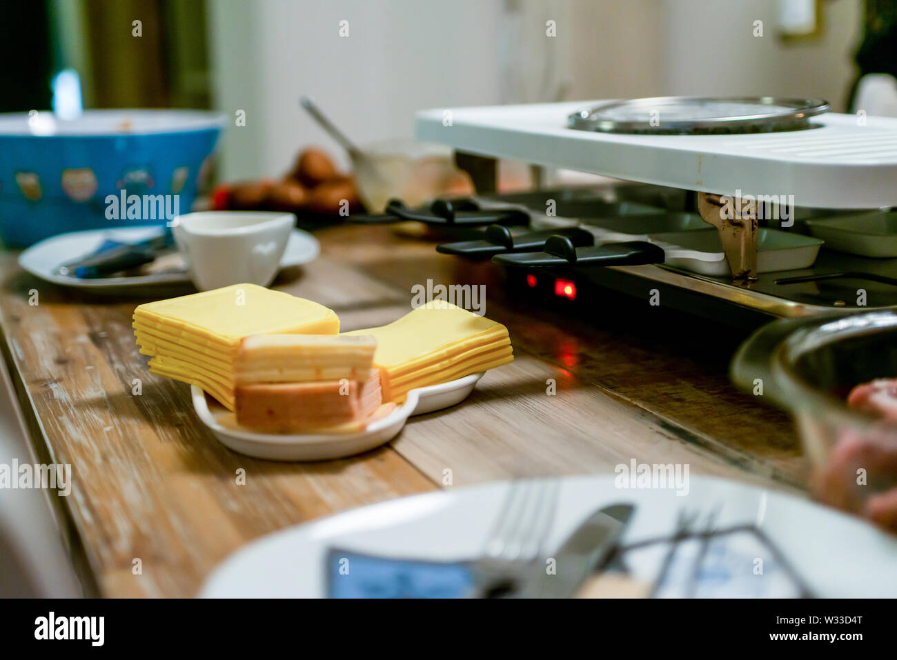 Swiss or Dutch raclette table filled with ingredients for a celebratory ...