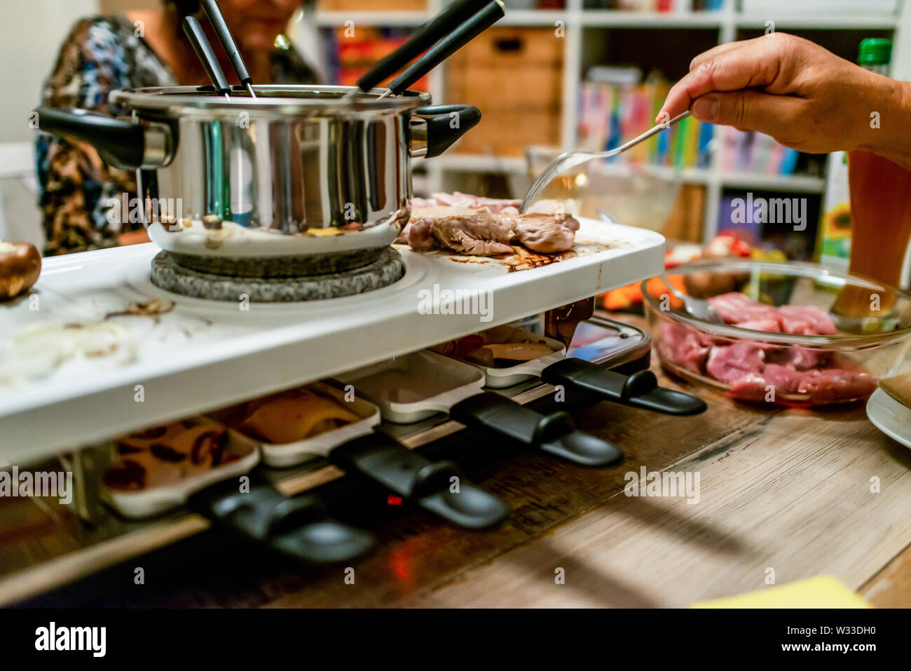 Swiss or Dutch raclette table filled with ingredients for a celebratory ...