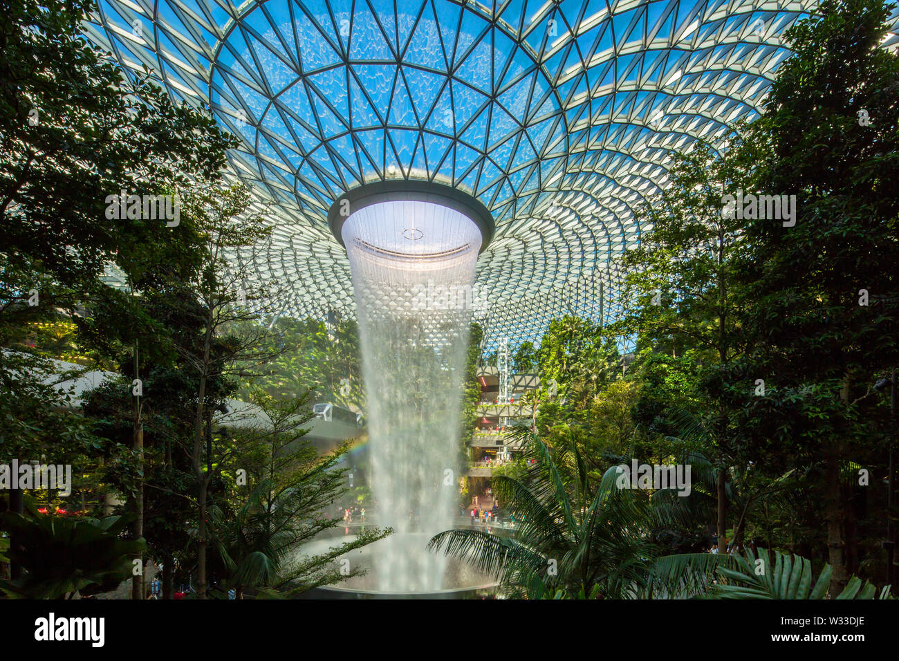 Landscape interior view of Jewel Changi Airport with blue sky and ...