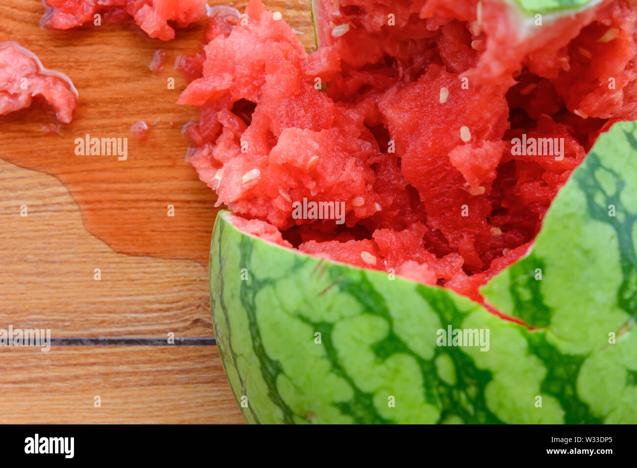 top view smashed watermelon on the ground close up Stock Photo - Alamy
