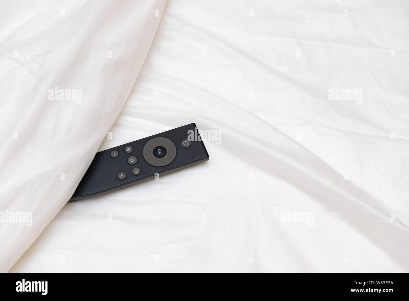remote control on the bed Stock Photo - Alamy