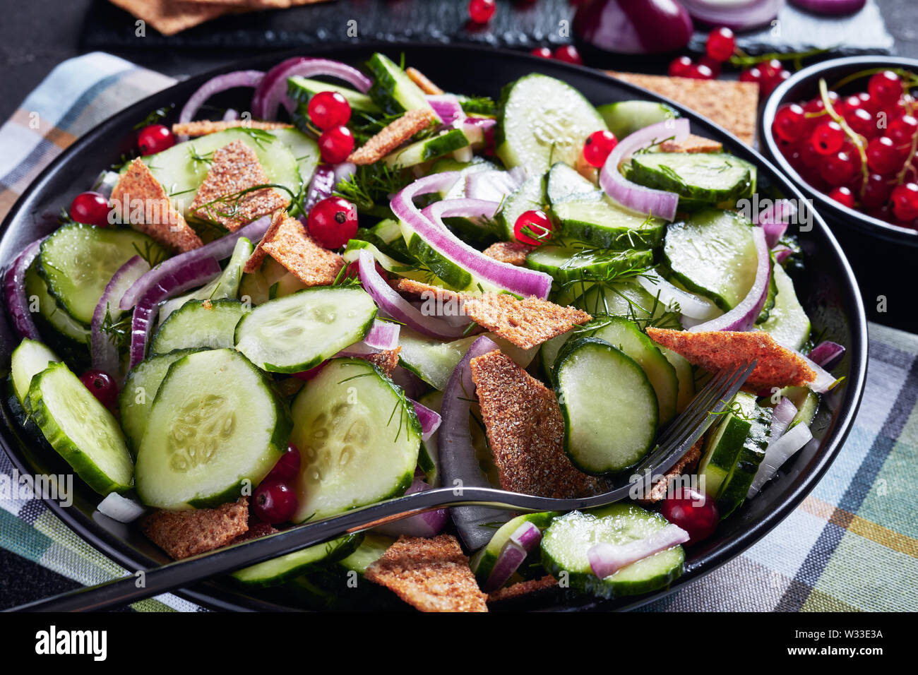 summer cucumber salad with red currant, marinated red onion and crisp ...