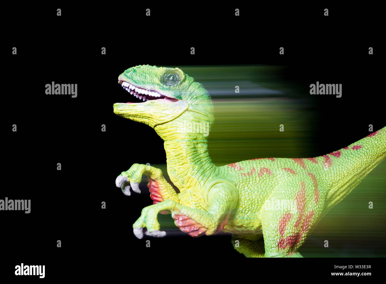 fast running velociraptor with streaks on black background Stock Photo ...
