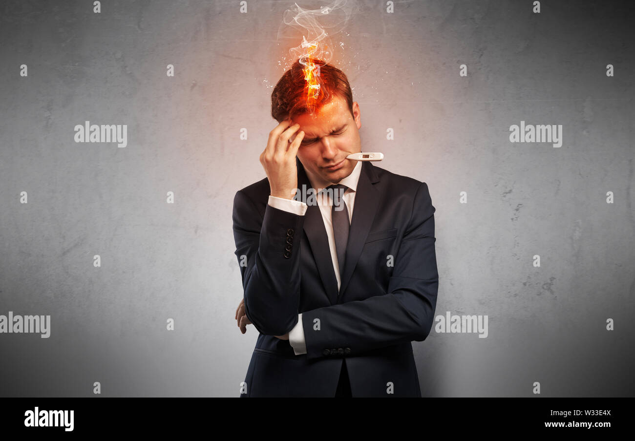 Fever businessman with burning head concept Stock Photo - Alamy