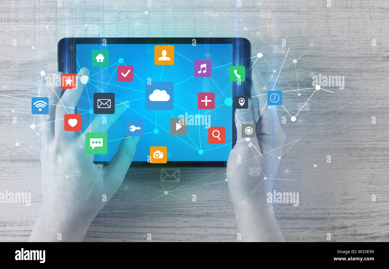 Hand touching multitask tablet with cloud wifi message social media ...