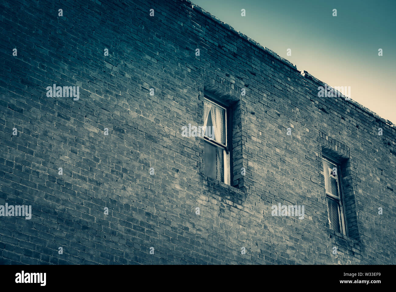 A negative space composition of a century old brick wall of a building ...