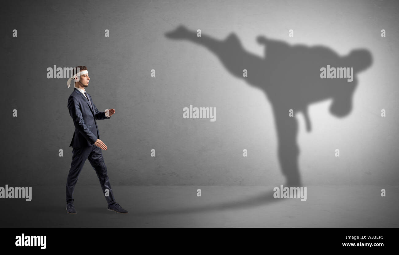 Young karate man confronting with his own shadow Stock Photo - Alamy