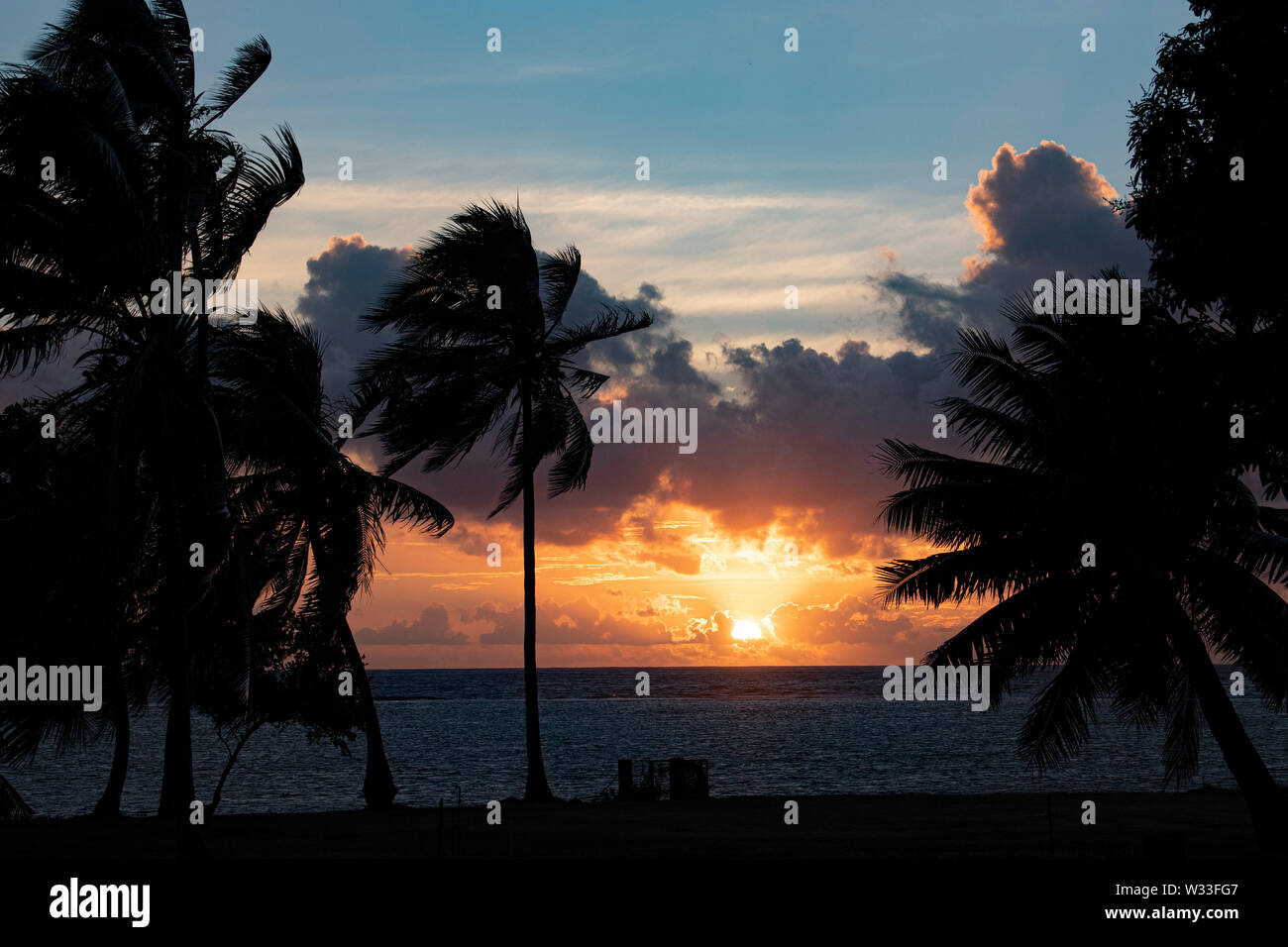 wonderful sunset in tahiti french polynesia beach Stock Photo - Alamy