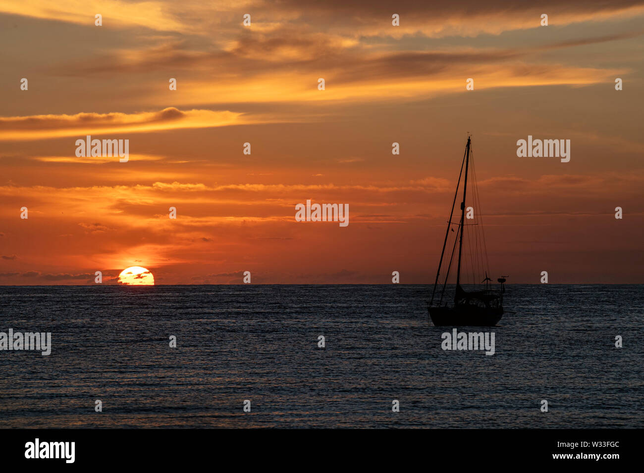 wonderful sunset in tahiti french polynesia beach Stock Photo - Alamy