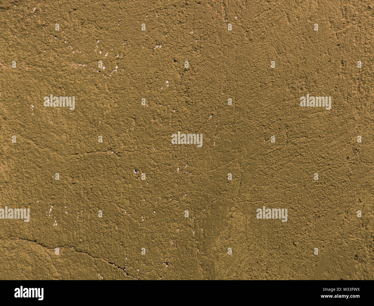 Old bronze wall covered with shabby uneven plaster. Texture of vintage ...