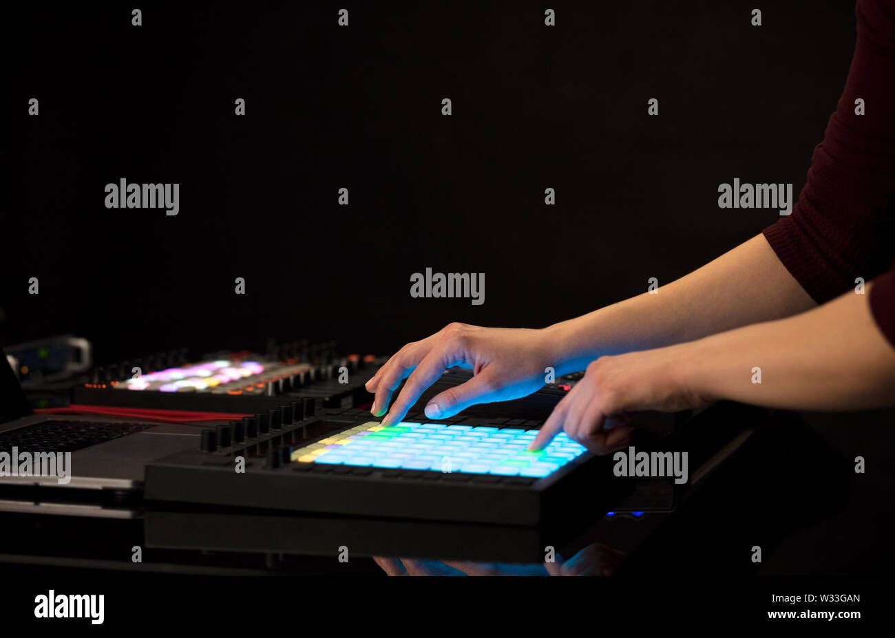 Dj hand remixing music on midi controller Stock Photo - Alamy