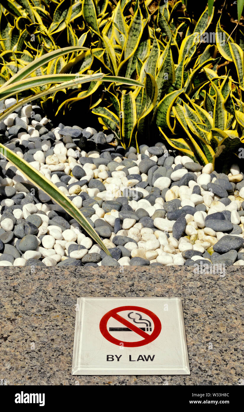 singapore, singapore - april 23, 2009: no smoing sign at the border of ...