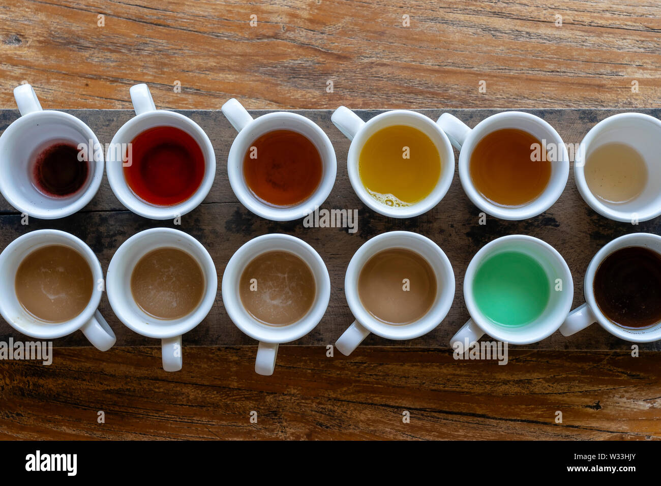Traditional Balinese coffee and tea after testing on the wooden table ...