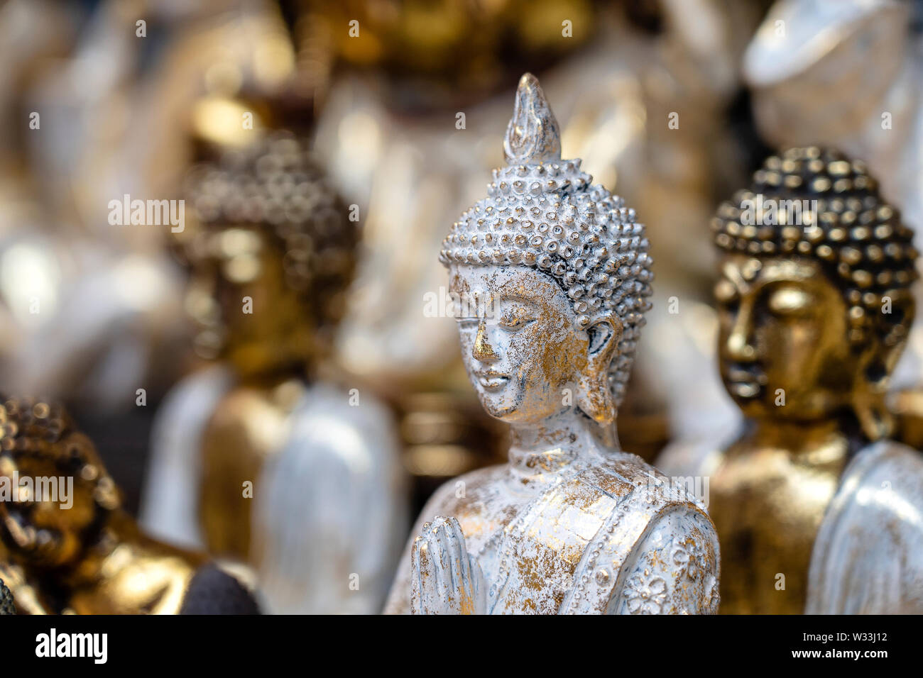 Buddha statue figures souvenir on display for sale on street market in ...