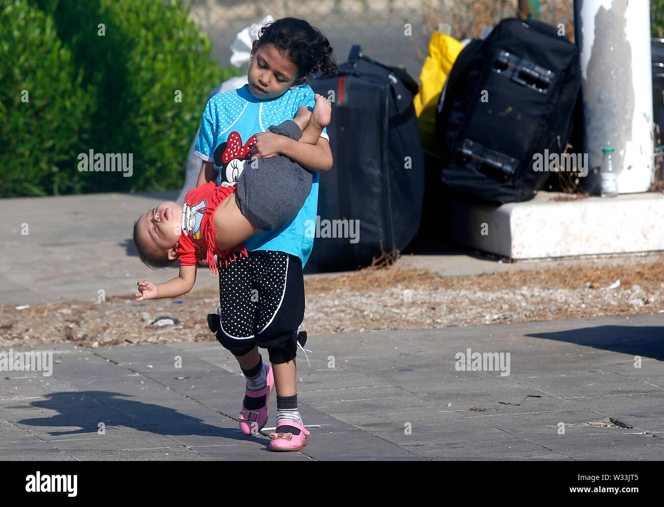 Beirut, Lebanon. 11th July, 2019. Syrian children wait to return to ...