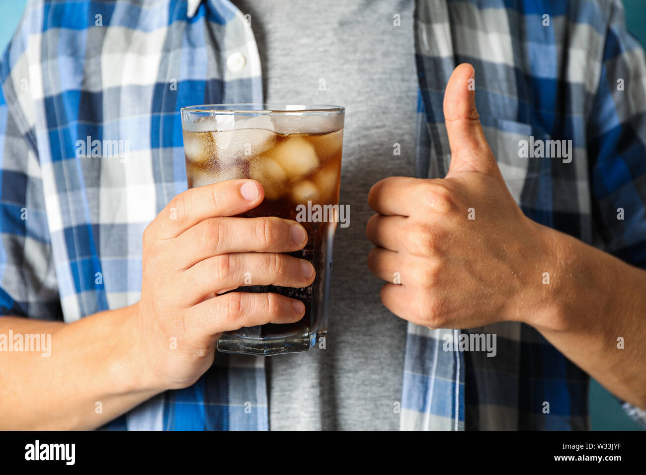 Man and hand and close up and cola hi-res stock photography and images ...
