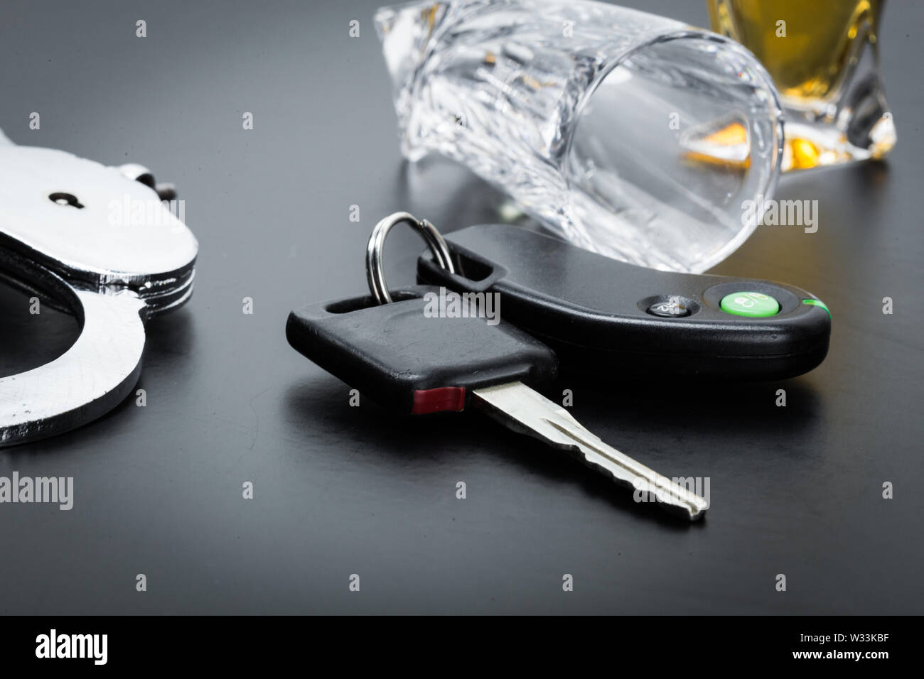 Car key on the bar with spilled alcohol Stock Photo - Alamy