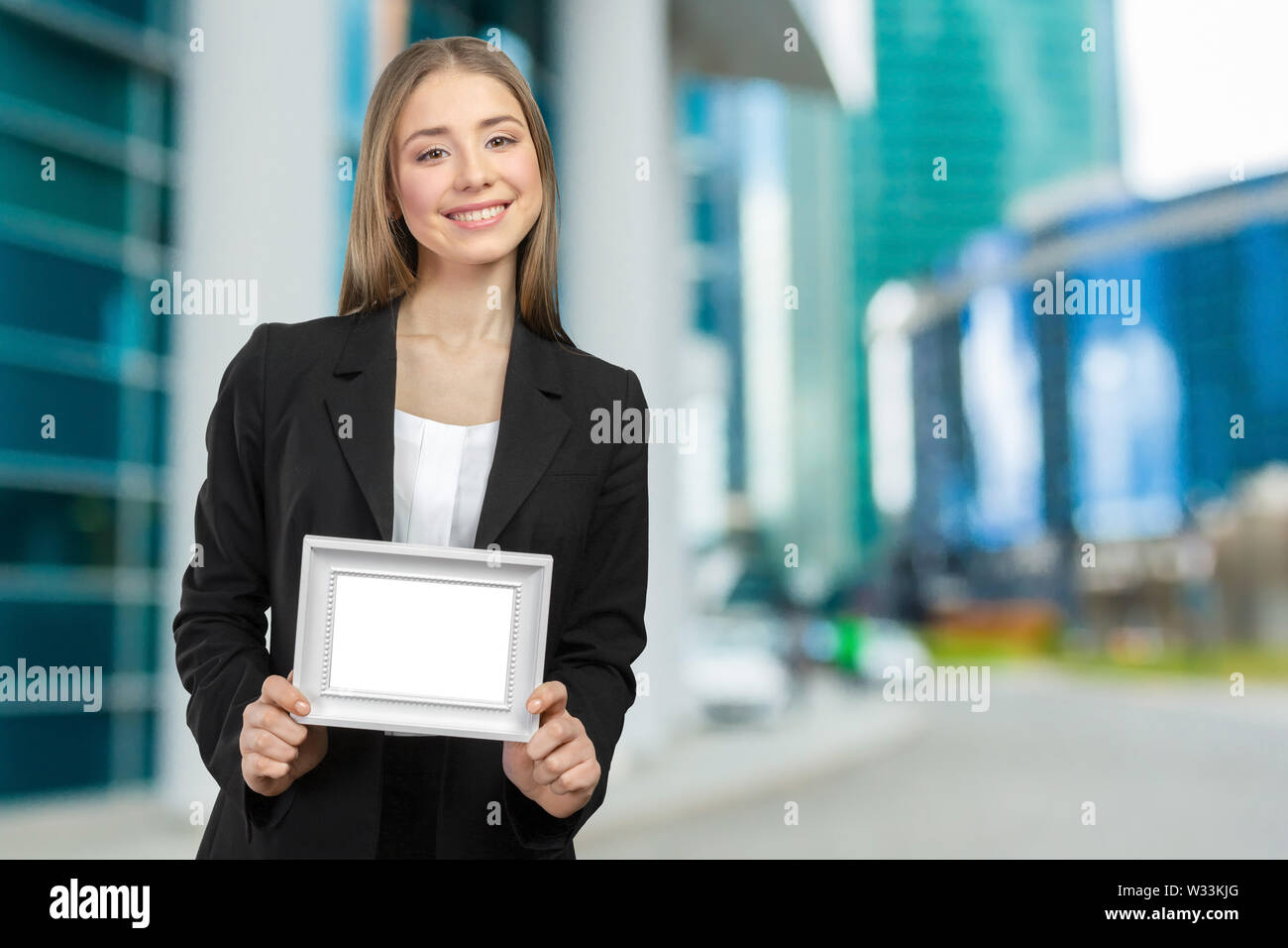 Beautiful happy smiling woman showing copy space Stock Photo - Alamy
