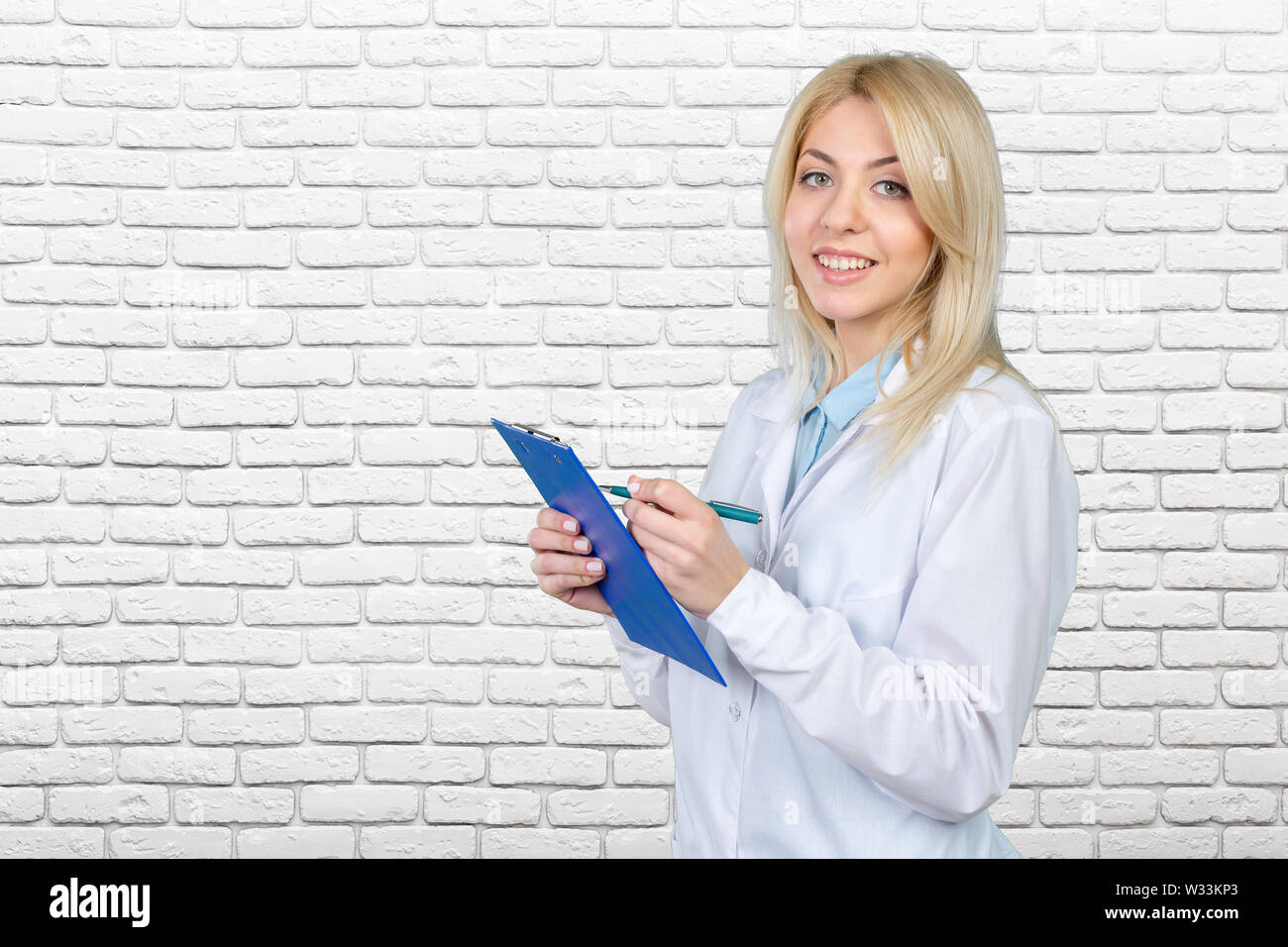 Woman doctor standing Stock Photo - Alamy