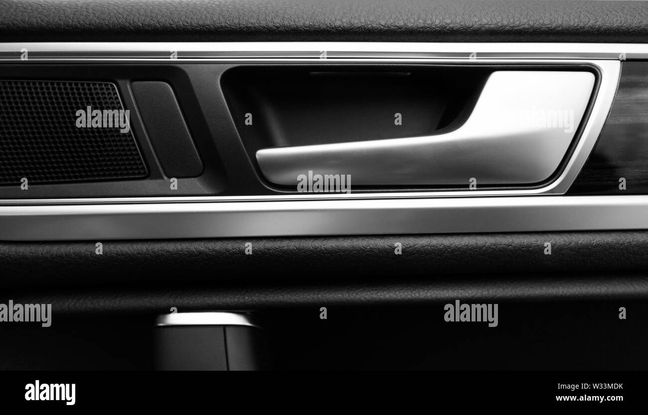 Inner door handle, modern car interior detail Stock Photo - Alamy