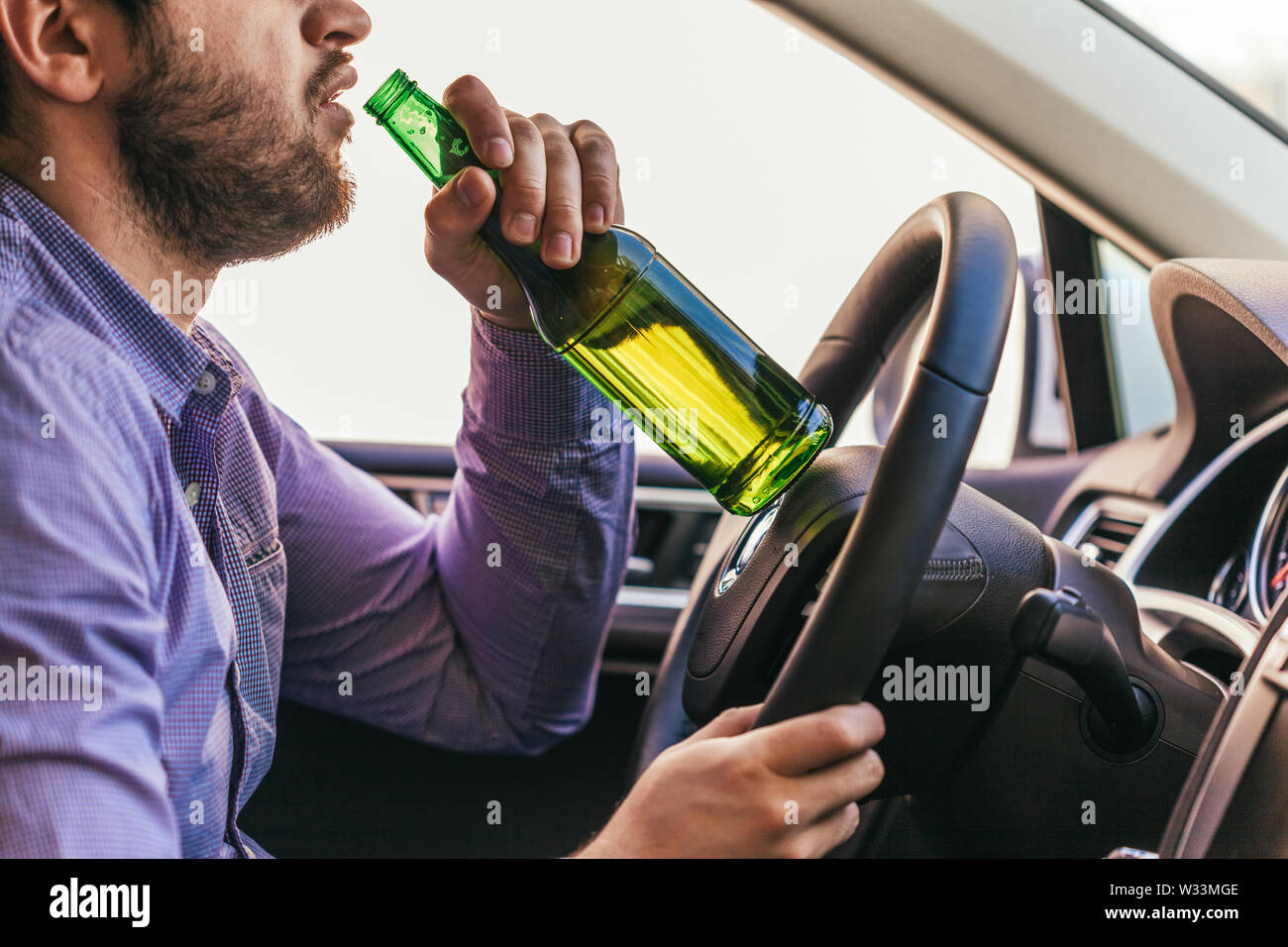 man drinking alcohol while driving the car Stock Photo - Alamy