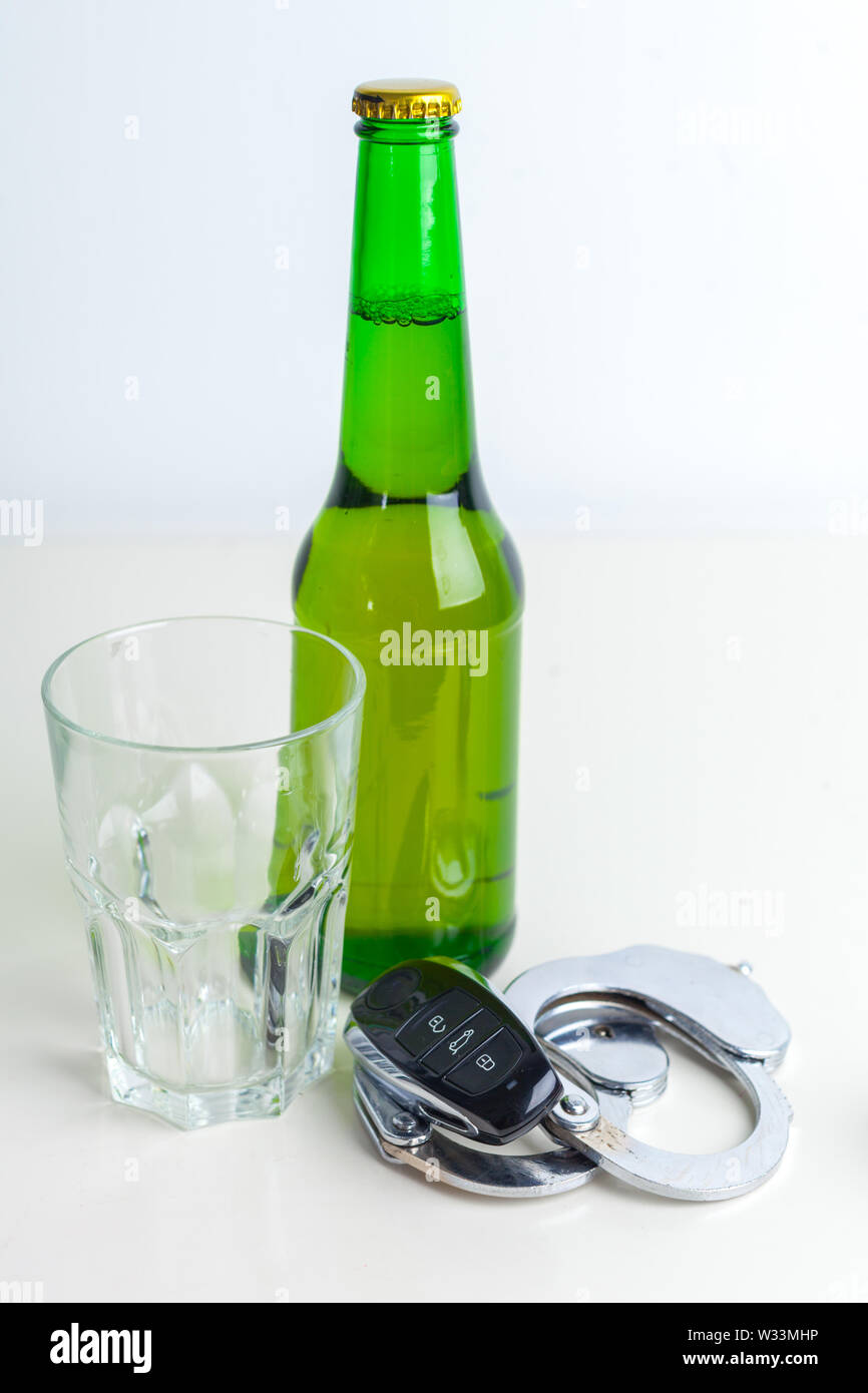 Drunk Driving Concept - Beer, Keys and Handcuffs Stock Photo - Alamy