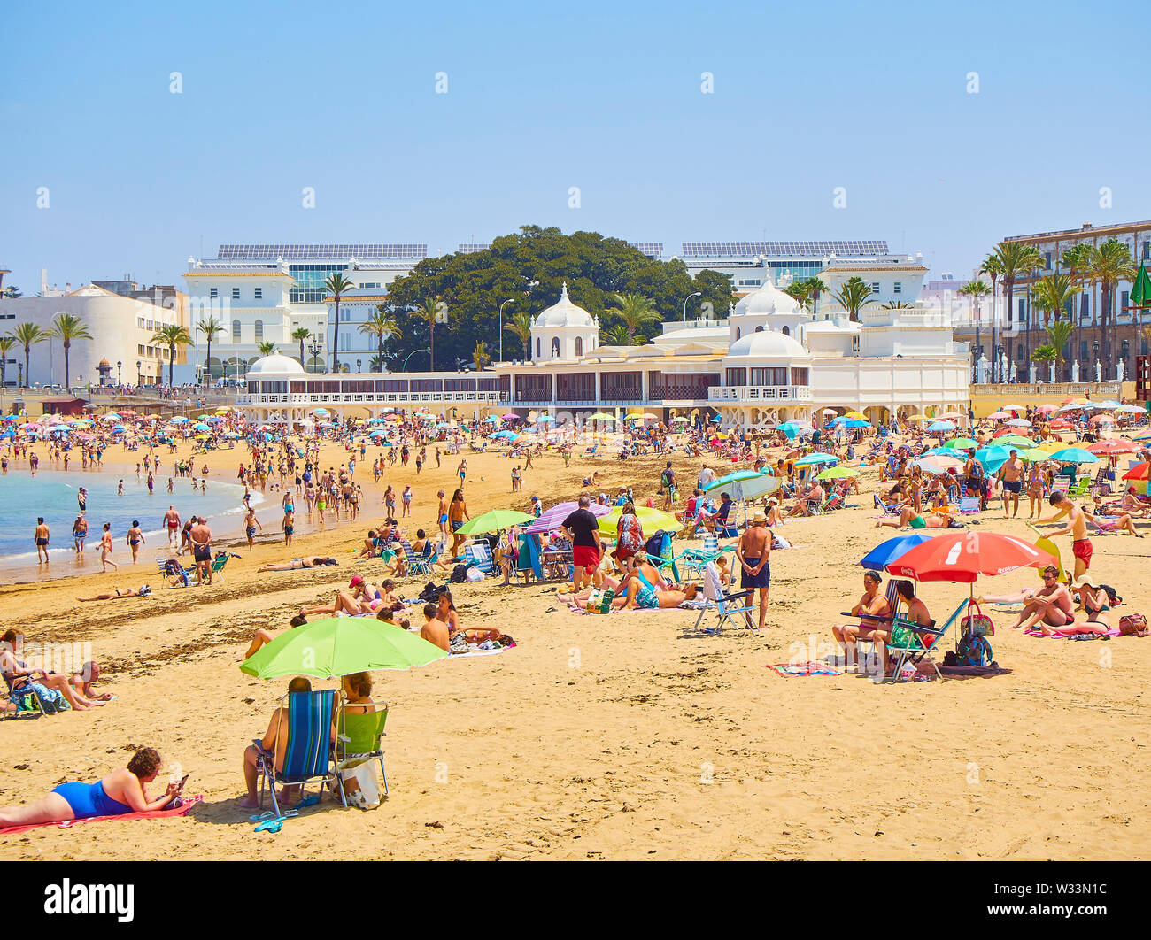 Cadiz, Spain - June 23, 2019. People enjoying a sunbathing in La Caleta ...