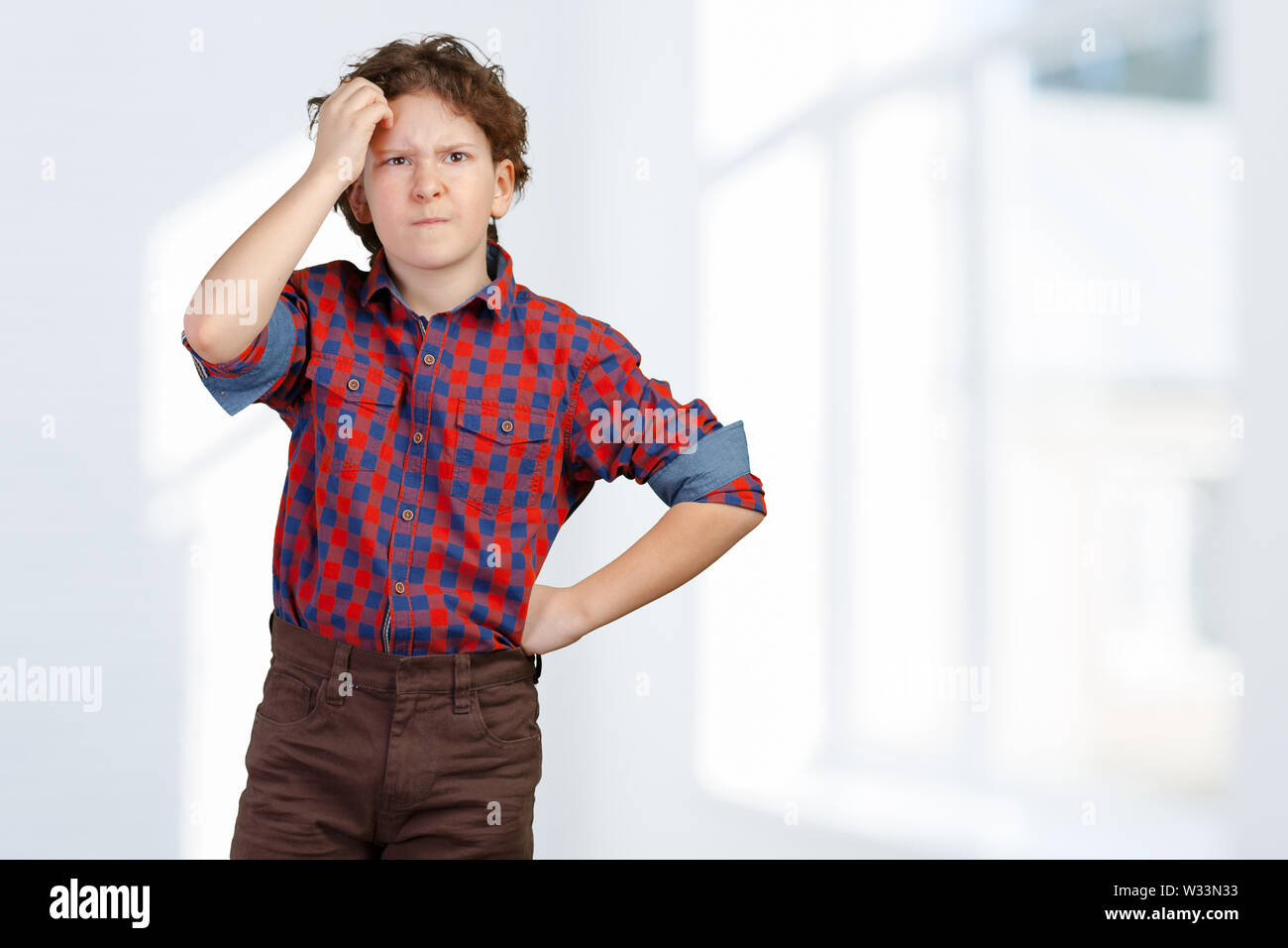 cute young boy thinking Stock Photo - Alamy