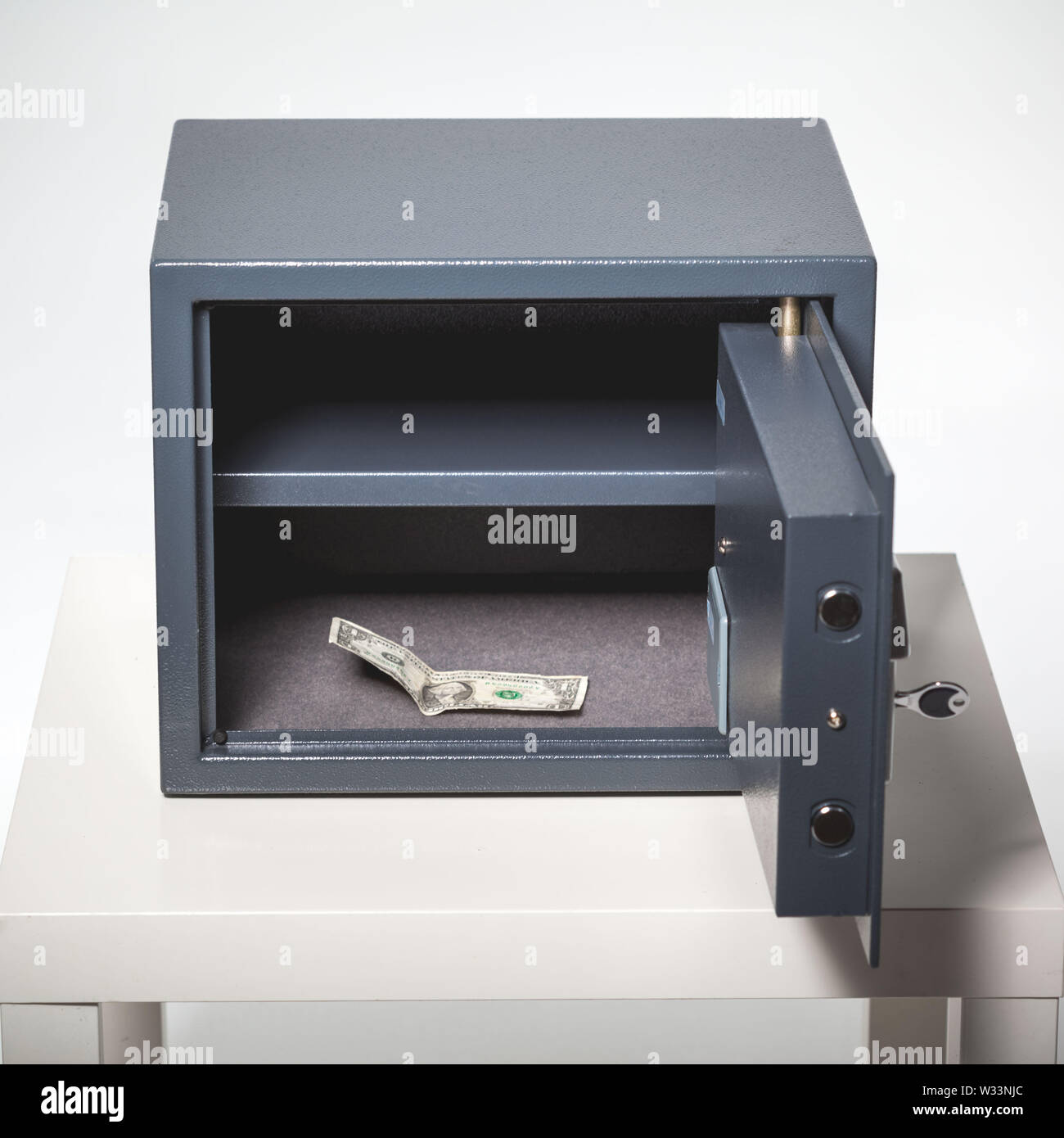 Safe with money Stock Photo - Alamy