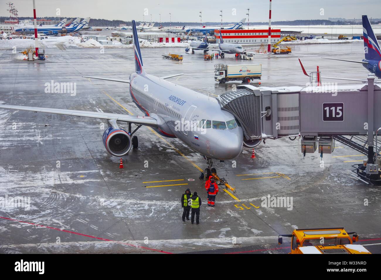 Winter day with airplane transport ground crew Stock Photo - Alamy