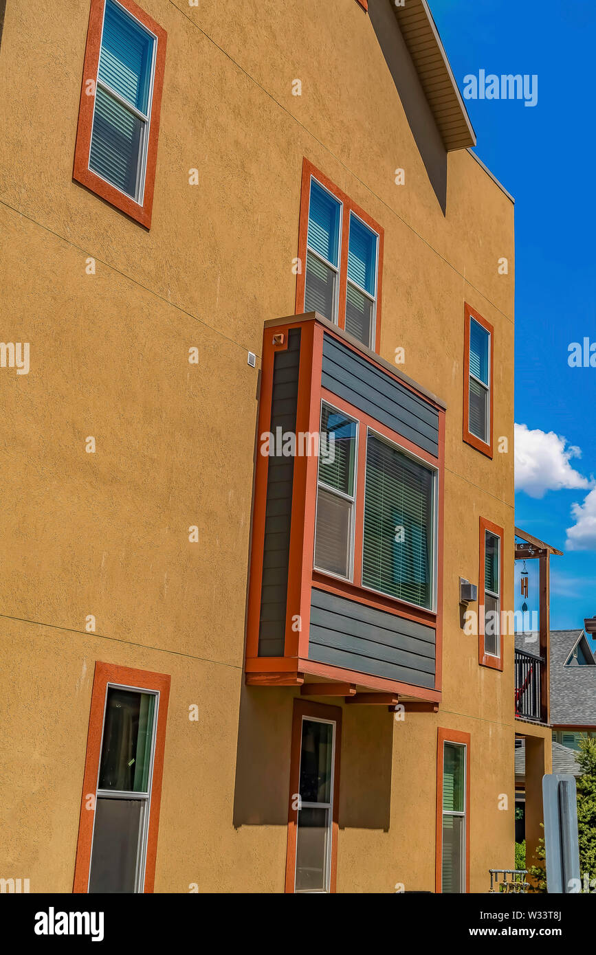 Residential building with a window protruding from the exterior wall. A ...