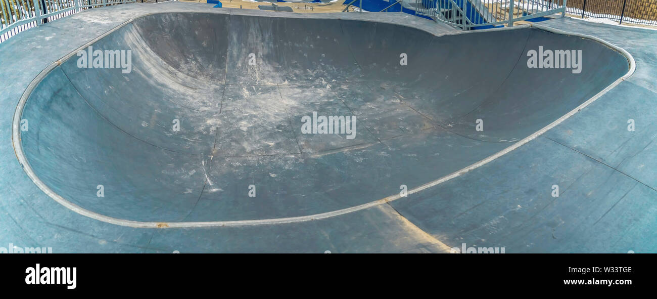 Conctere skate park with close view of the bowl shaped skating ramp ...