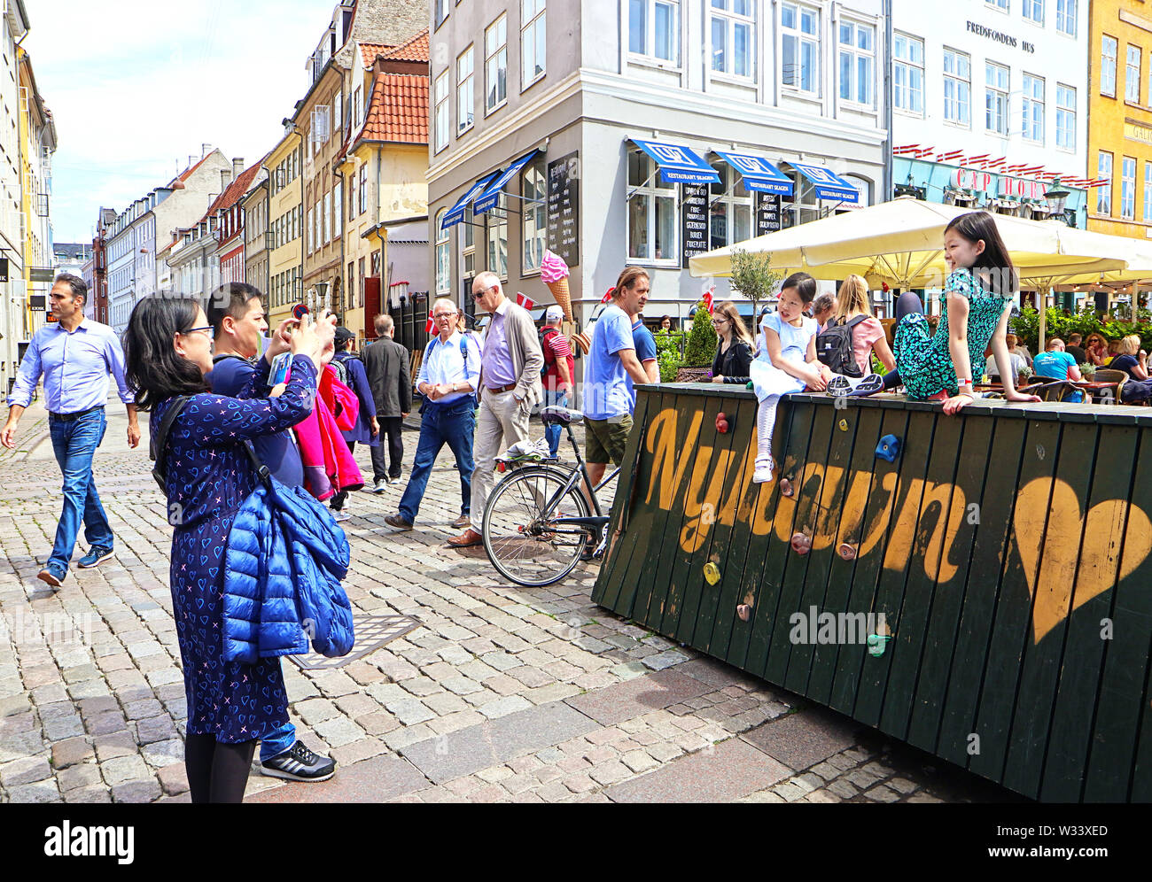 COPENHAGEN, DENMARK - JUNE 16, 2019 Tourist family take pictures at ...