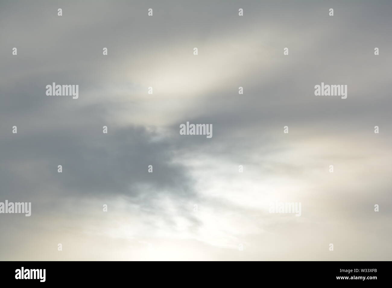 Patterns of clouds in the spring sky with the sun backlighting Stock ...