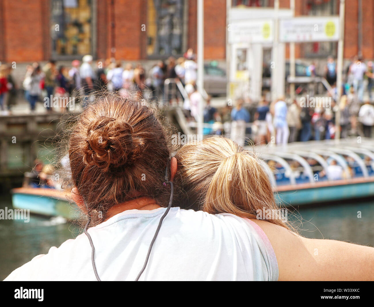 COPENHAGEN, DENMARK - JUNE 16, 2019 Young couple at Nyhavn harbor ...