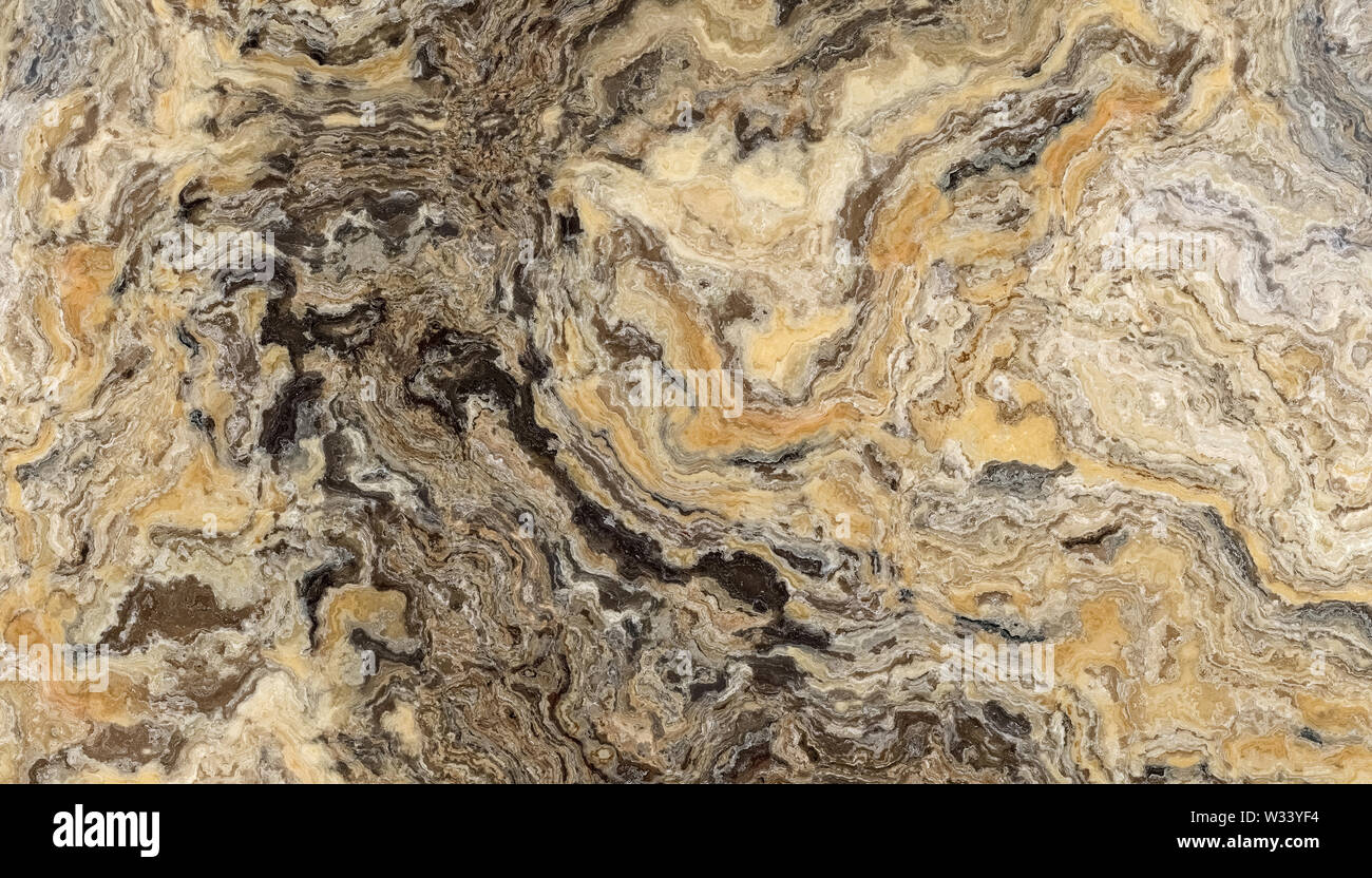 Yellow marble pattern with black inclusions. Abstract texture and ...